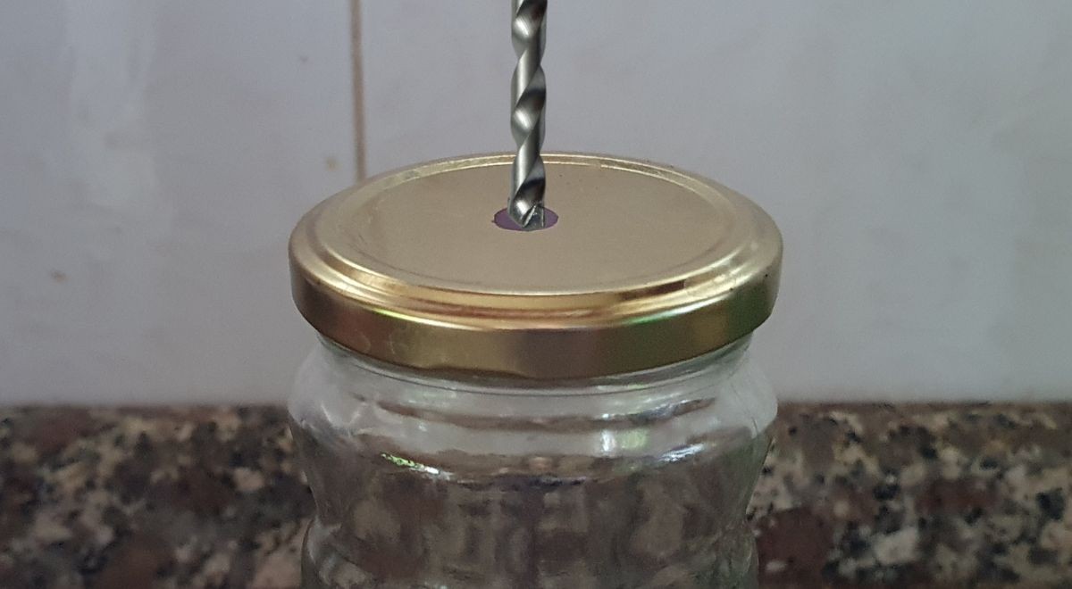 A small hole and voilà: a glass jar is transformed into a colorful and ...